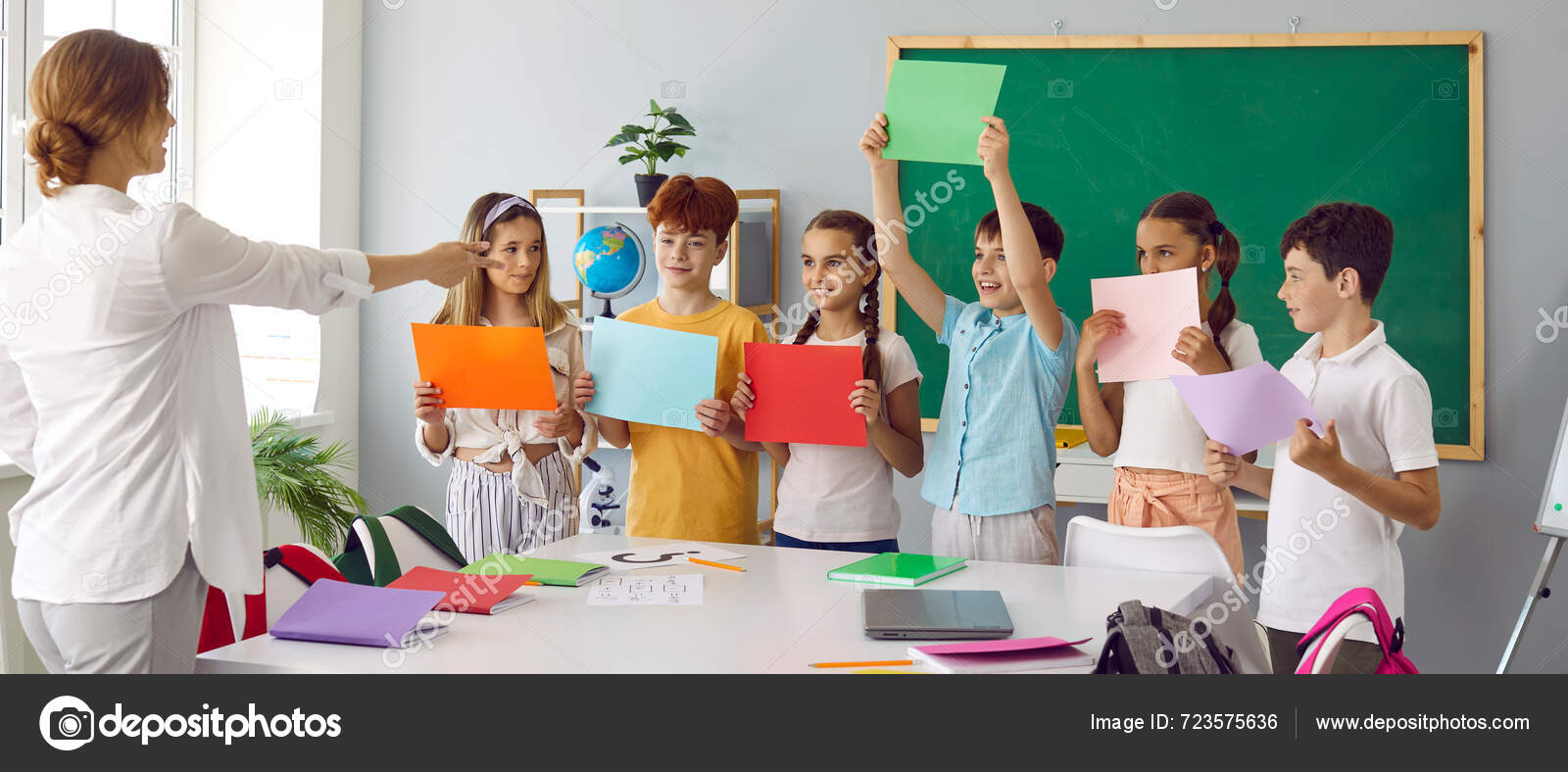 Elementary School Students Showing Blank Paper Sheets Teacher Classroom ...