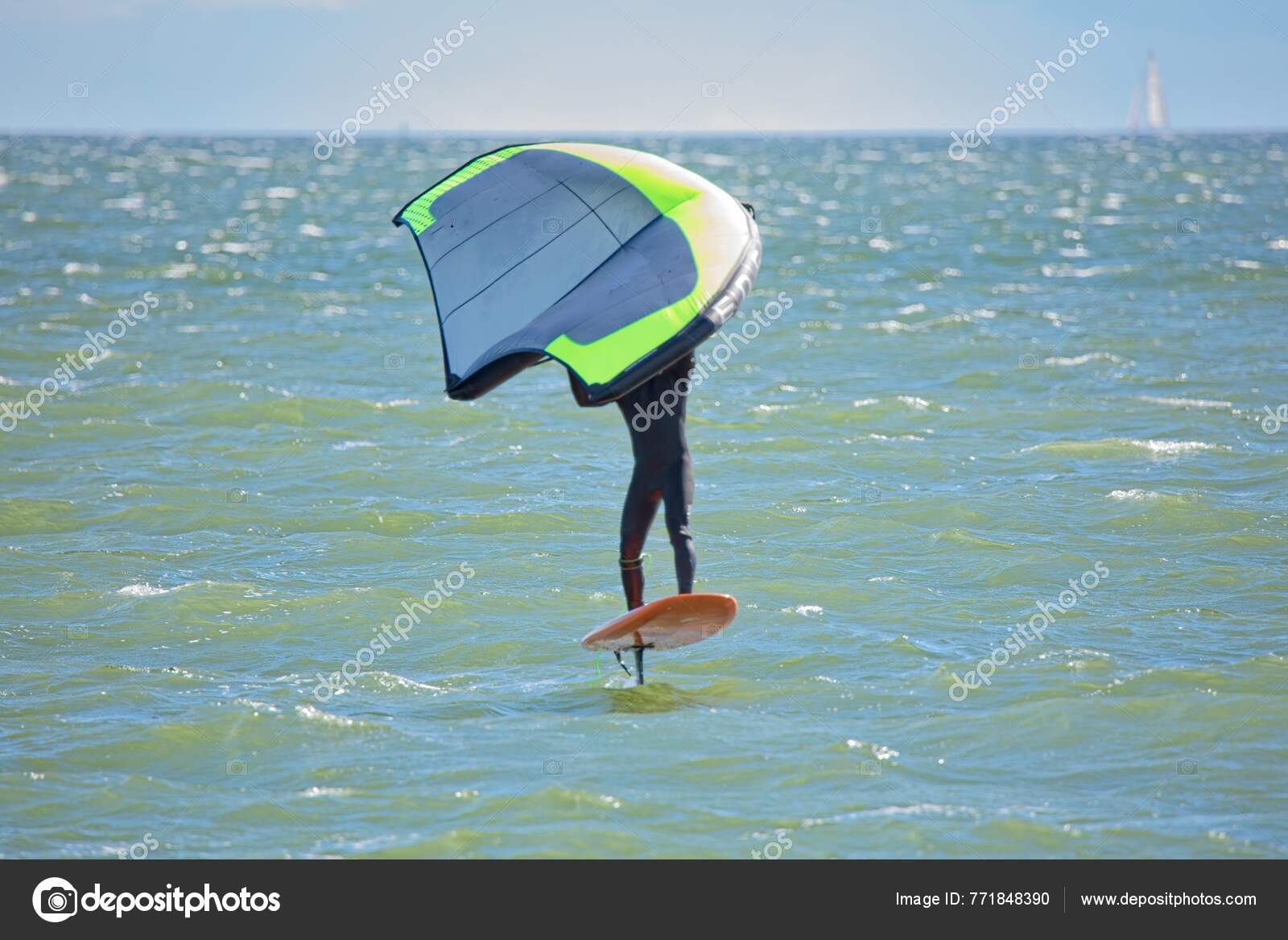 Man Wing Foiling Using Handheld Inflatable Wing Hydrofoil Surfboard Sea ...