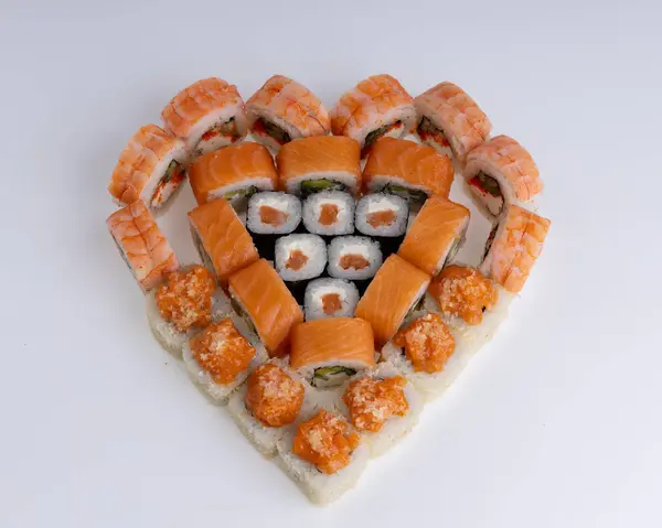 Heart shaped set of sushi rolls for Valentines Day. Menu or delivery ...