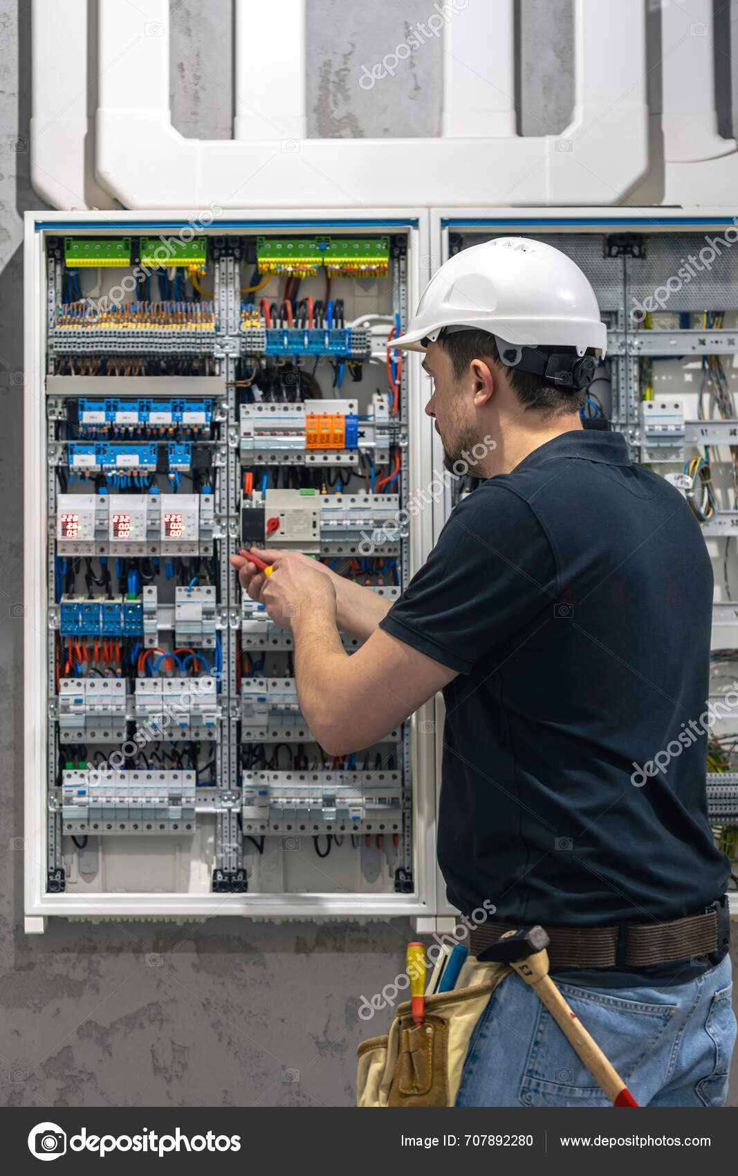 Male Electrician Works Switchboard Using Electrical Connection Cable ...