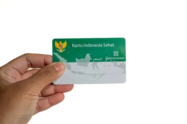 Hand holding Indonesian Government Health Insurance Card or (Kartu BPJS ...