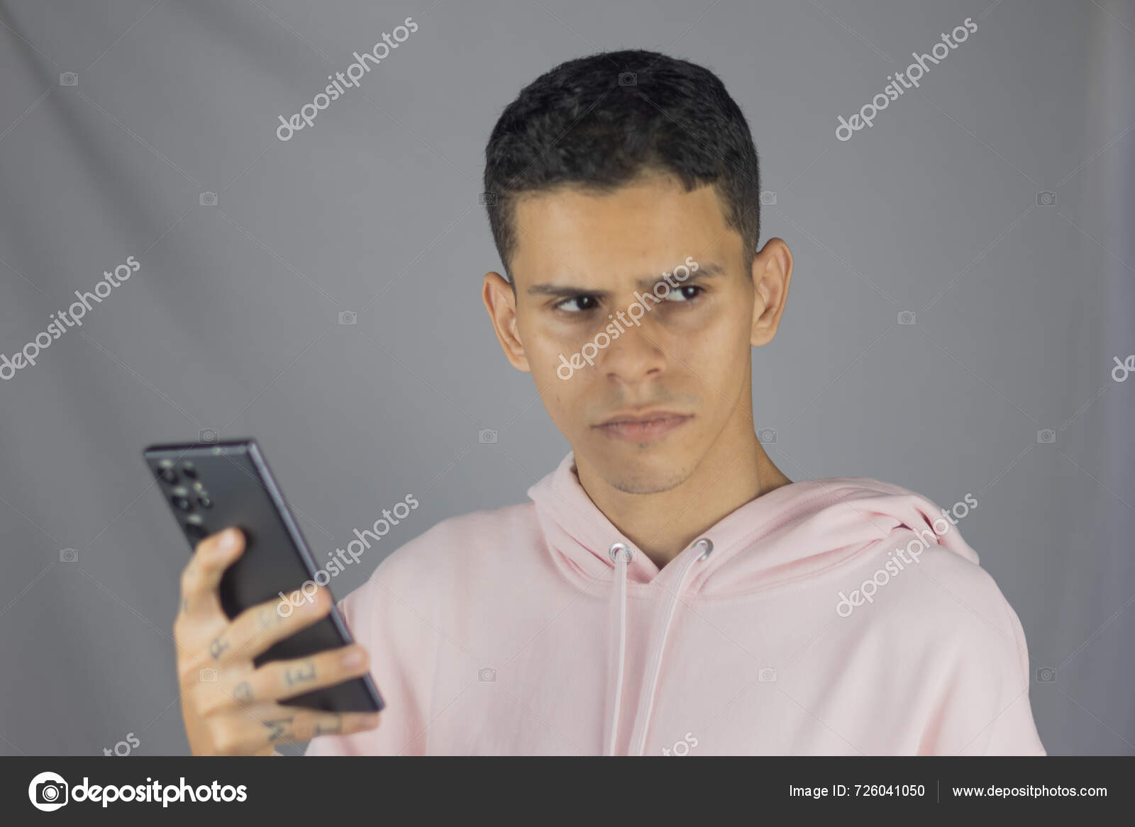 Young Man Holding Mobile Phone — Stock Photo © j1olly #726041050 Young Man Holding Mobile Phone — Stock Photo © j1olly #726041050