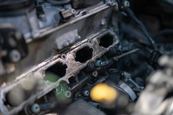 Close up of dirty intake manifold ports. Engine cleaning process the ...