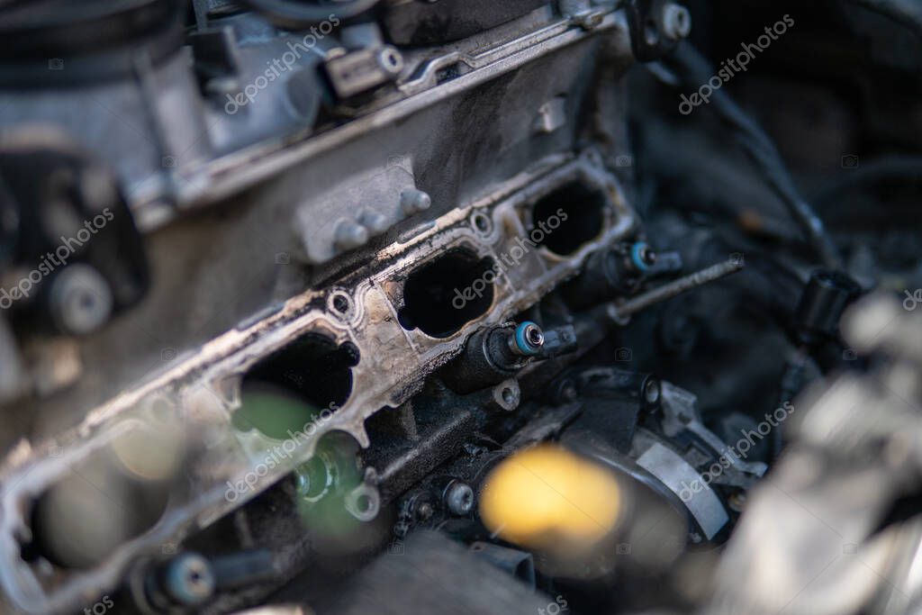 Close up of dirty intake manifold ports. Engine cleaning process the ...