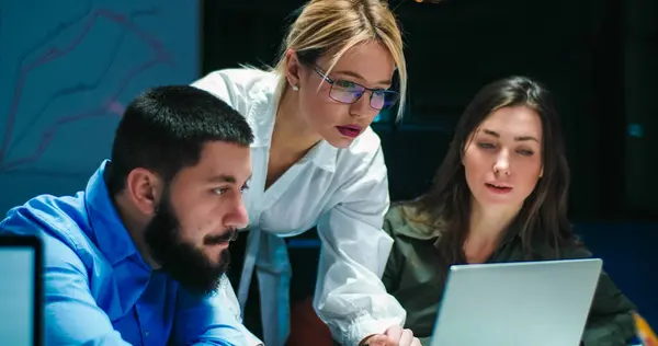 Caucasian boss checking work of office workers and explaining something ...