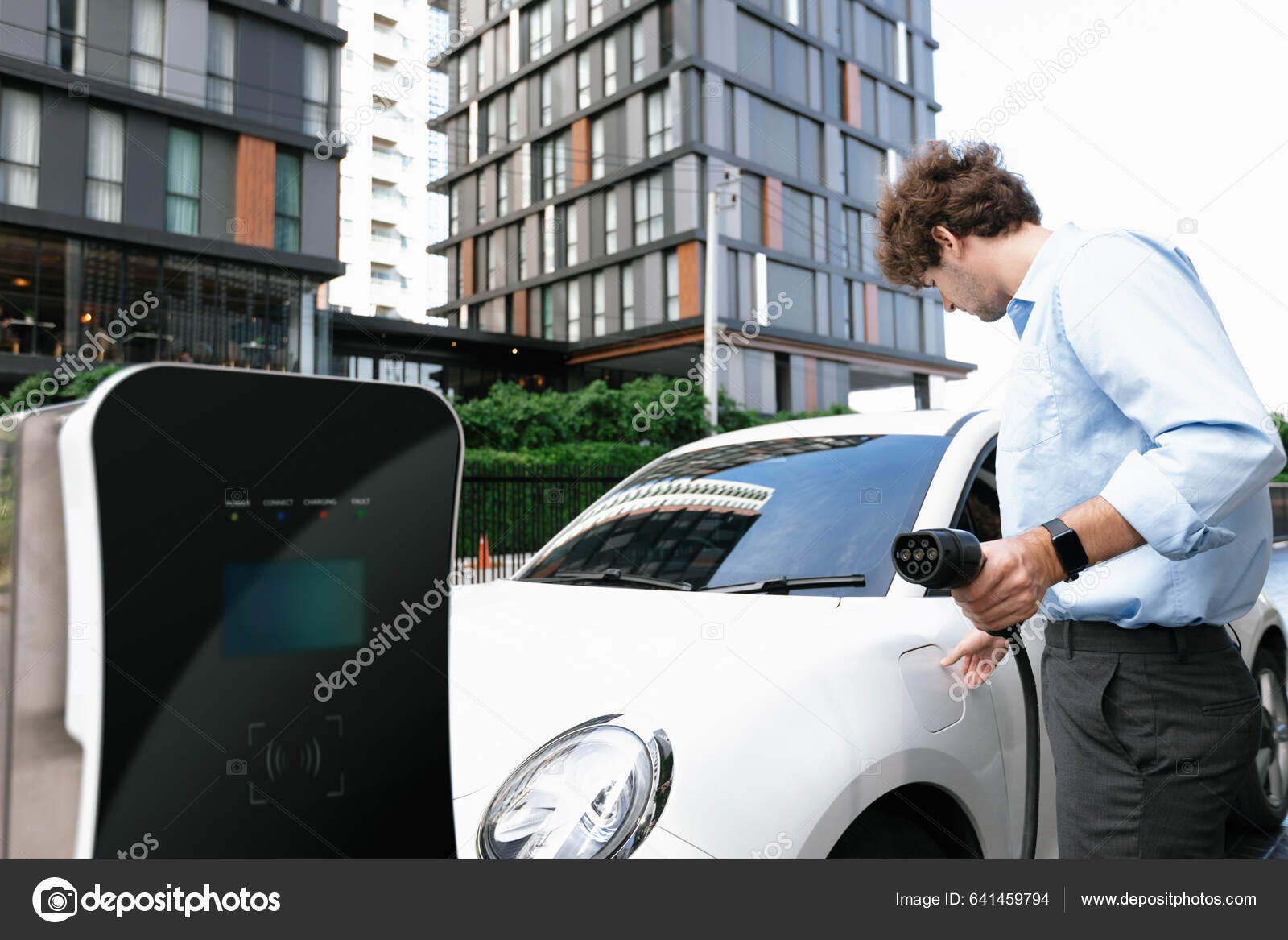 Progressive Businessman Insert Charger Plug Charging Station His ...