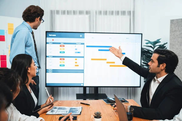 Project manager planning schedules for business task at meeting room ...