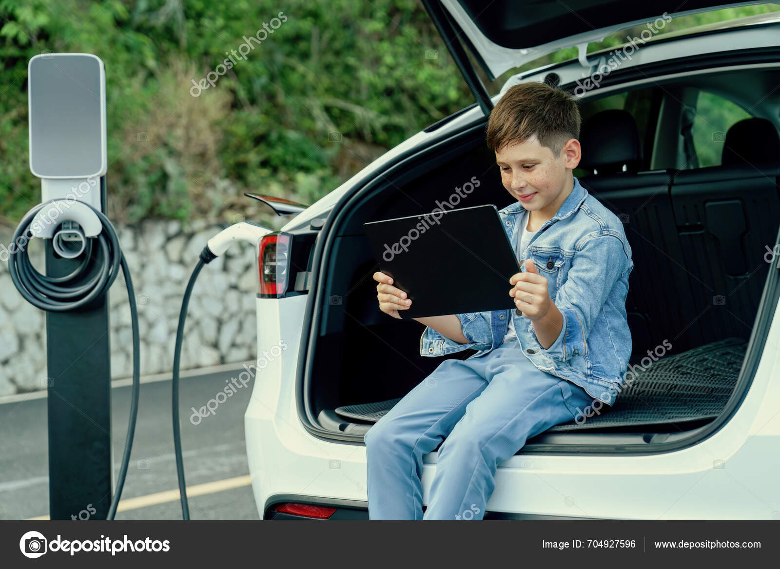 Little Boy Sitting Car Trunk Using Tablet While Recharging Eco — Stock ...