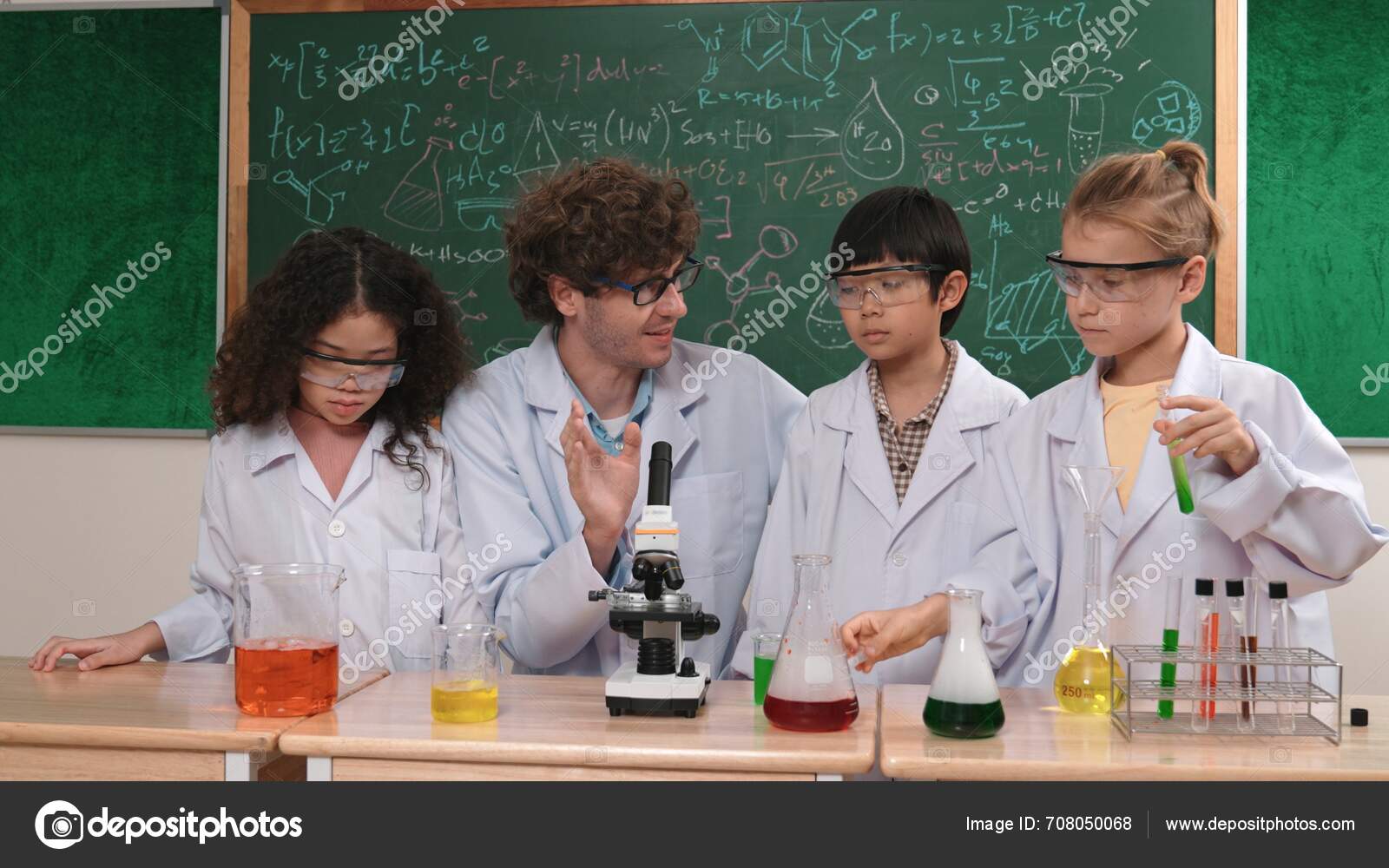 Skilled Child Hold Tube While Doing Experiment While Smart Teacher ...