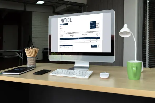 Invoice on computer screen from accounting application. Computer ...
